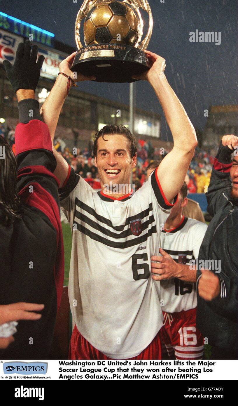 Washington DC United's John Harkes lifts the Major Soccer League Cup ...
