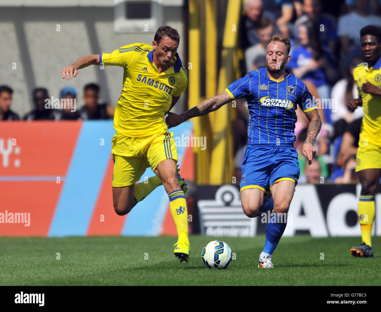 Chelsea XI's Nemanja Matic (left) and AFC Wimbledon's Sean Rigg ...
