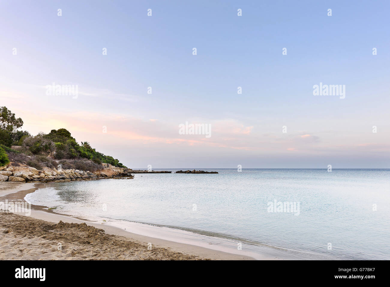 Photo of sea in protaras, cyprus island, with rocks and sand at sunset ...