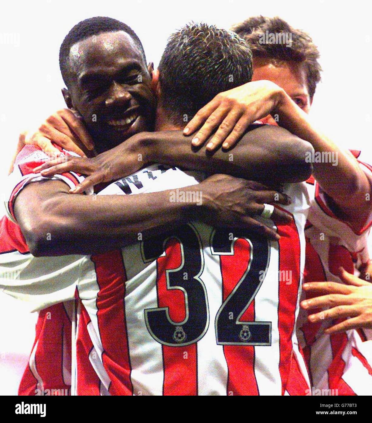 Sheffield United's Steve Kabba (left) celebrates with team mates after ...