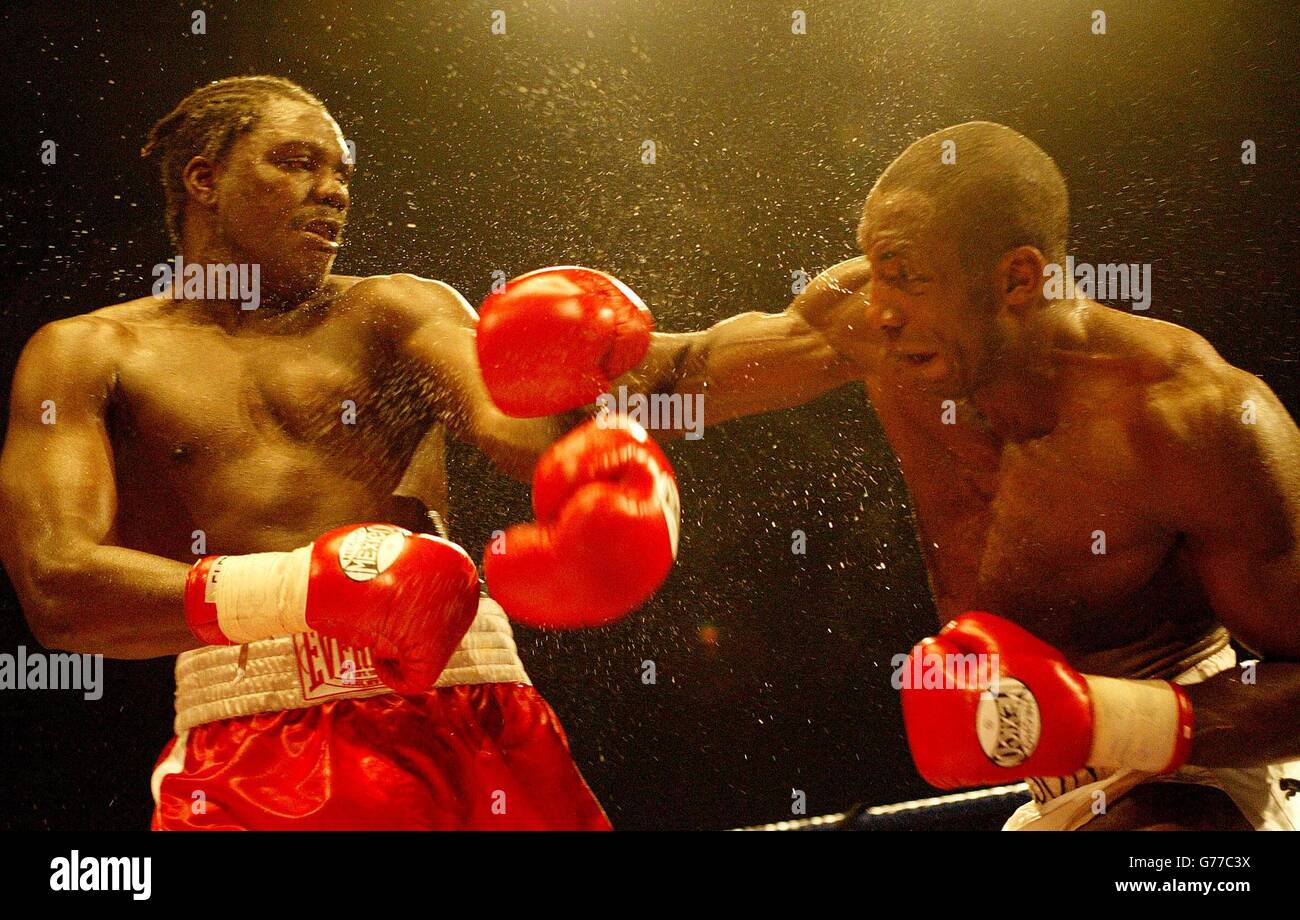 Johnny Nelson who retained his title throws a right hand while drawing ...