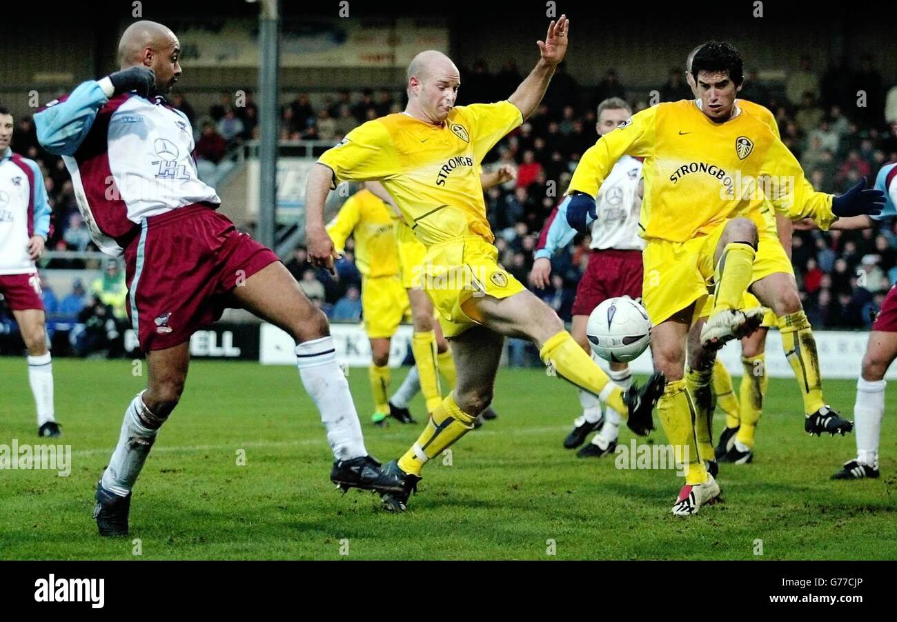 Scunthorpe's Martin Carruthers (L) shot is kept out by Leeds United's ...