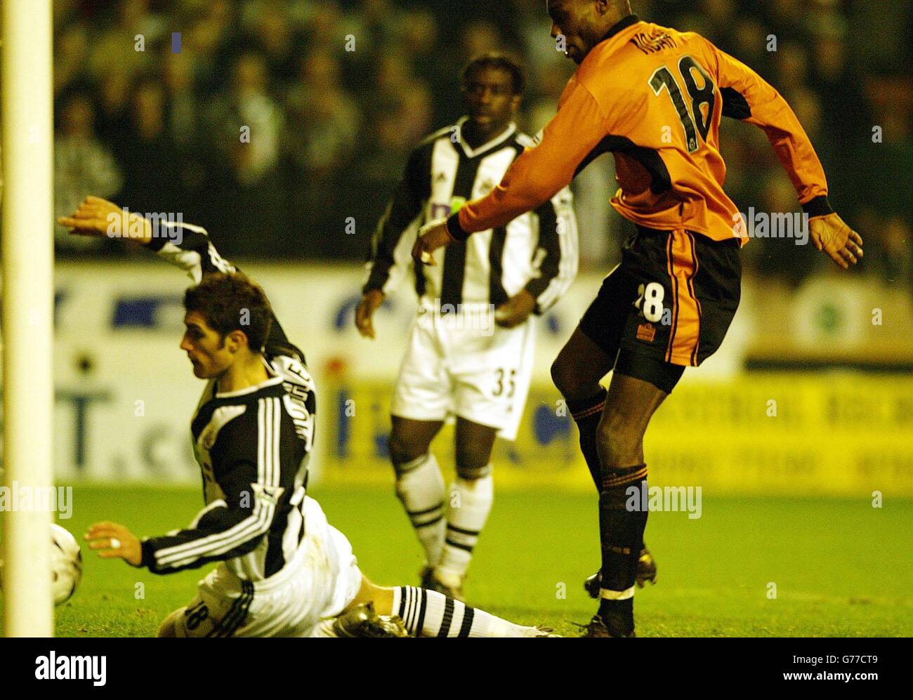 Wolverhampton Wanderers' George Ndah (right) slips the ball past ...