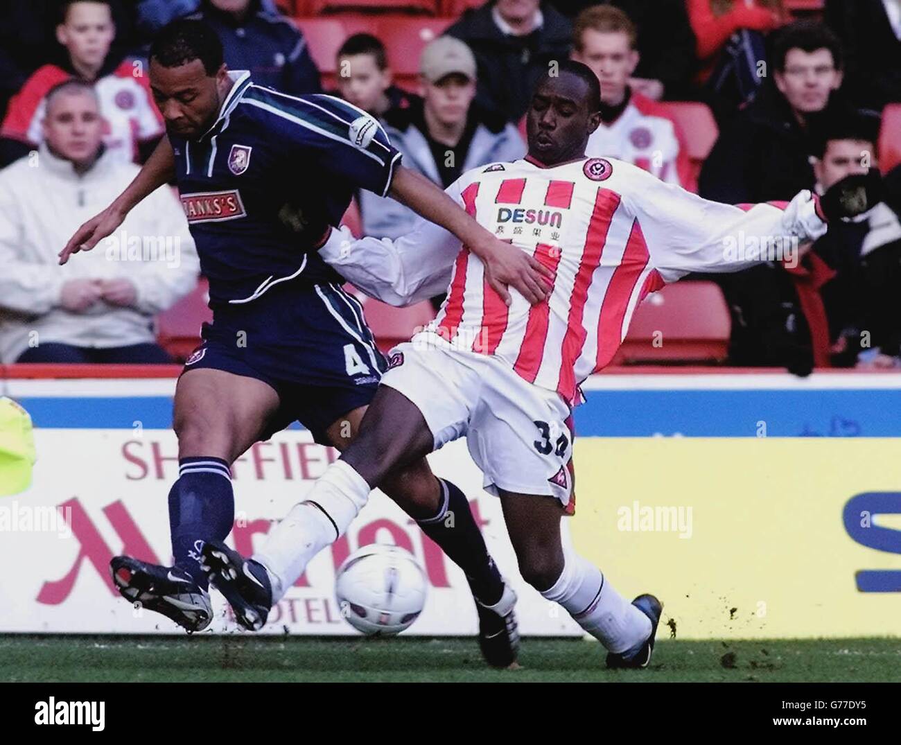 Sheffield United's Steve Kabba tackles Walsall's Matt Carbon during ...