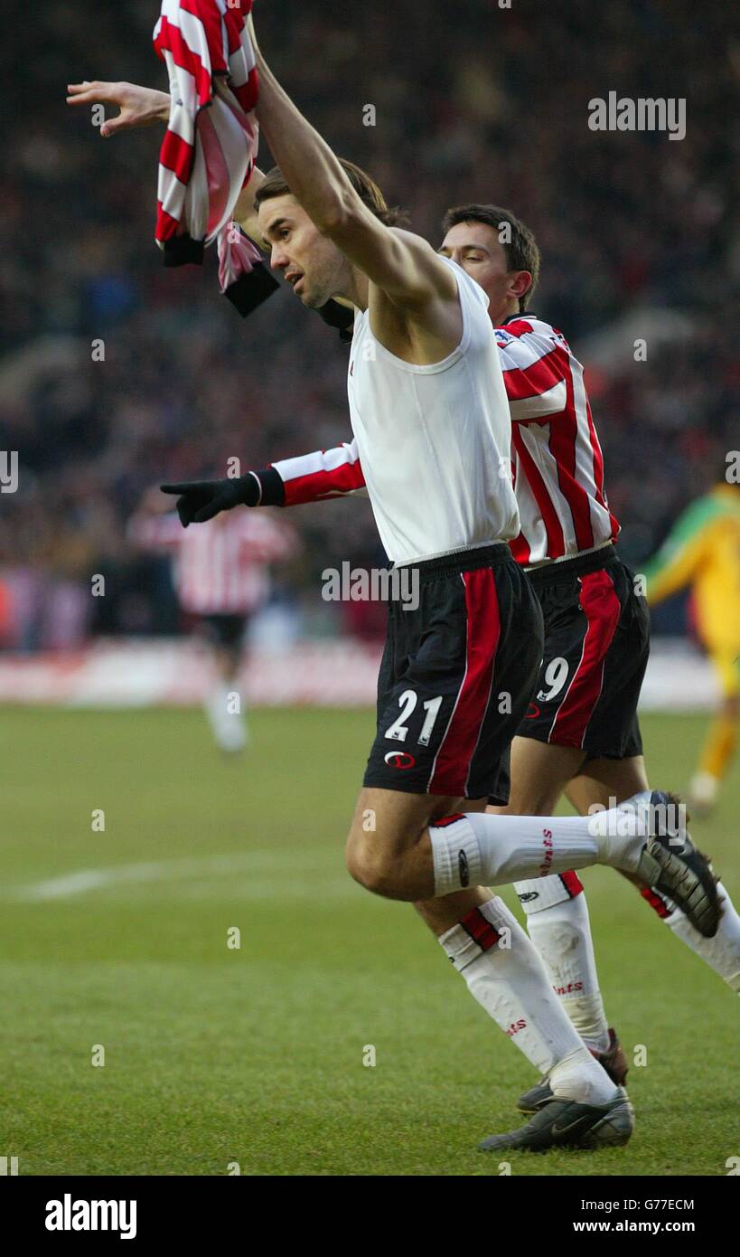 Southampton goal scorer Jo Tessem rips off his shirt to celebrate ...