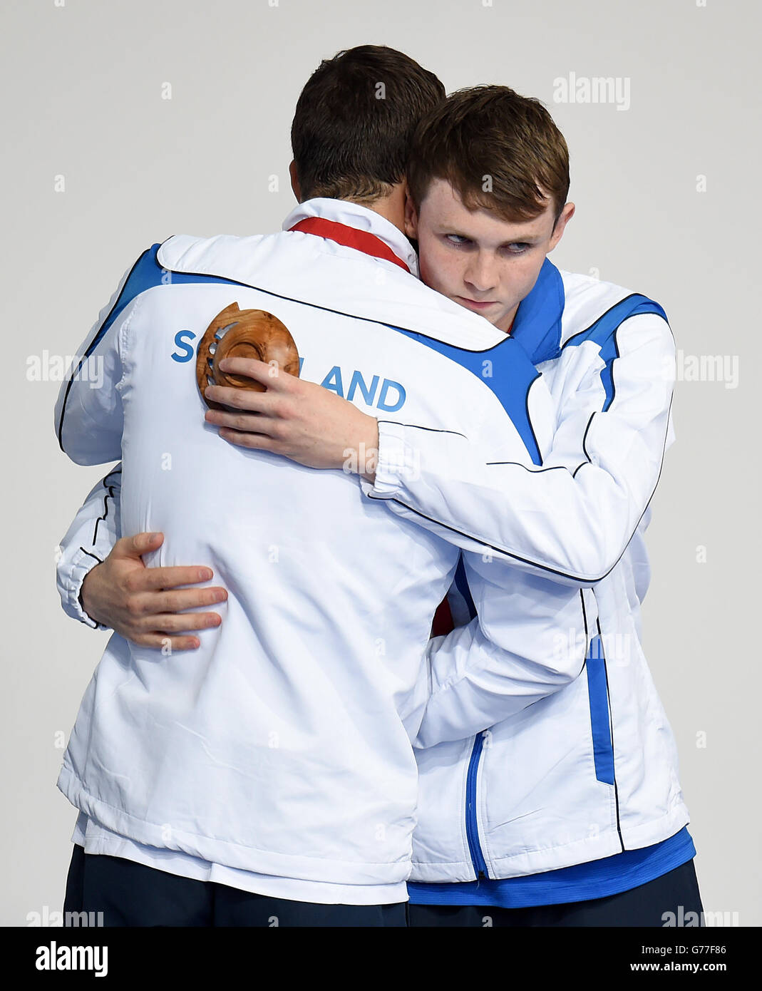 Scotland's Ross Murdoch (right) embraces Michael Jamieson on the podium ...