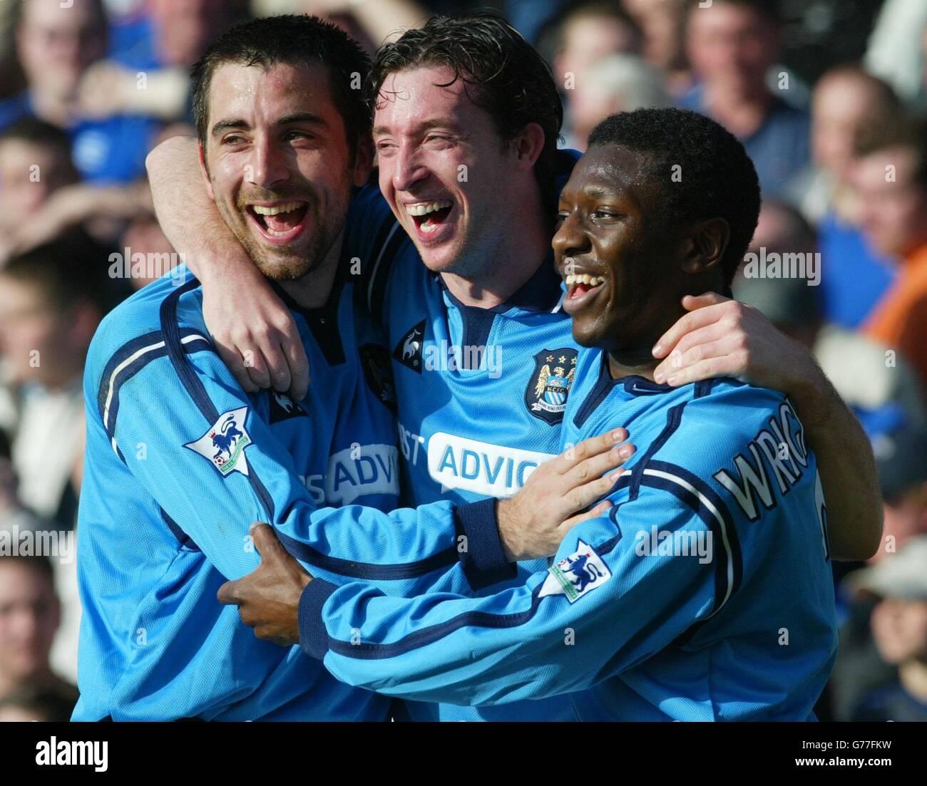 Manchester City's Robbie Fowler (centre) celebrates with Kevin Horlock ...