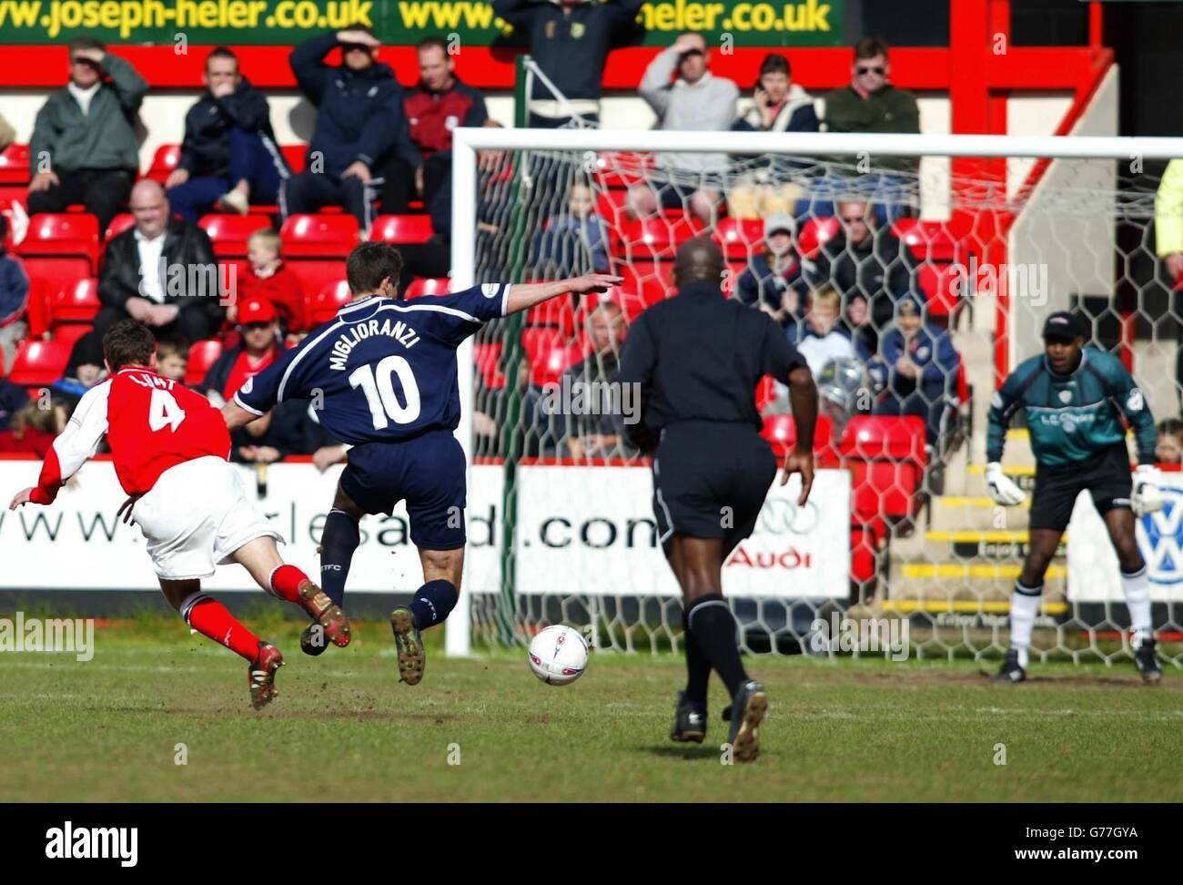 Swindon's Stefani Migniorazi (blue) breaking away from Crewe's Kenny ...