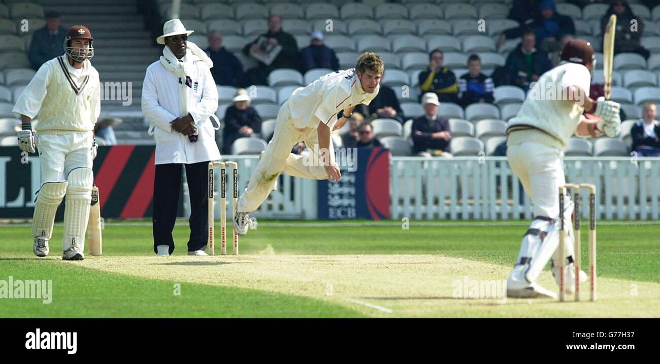 Surrey captain Adam Hollioake (left) watches Lancashire bowler James ...