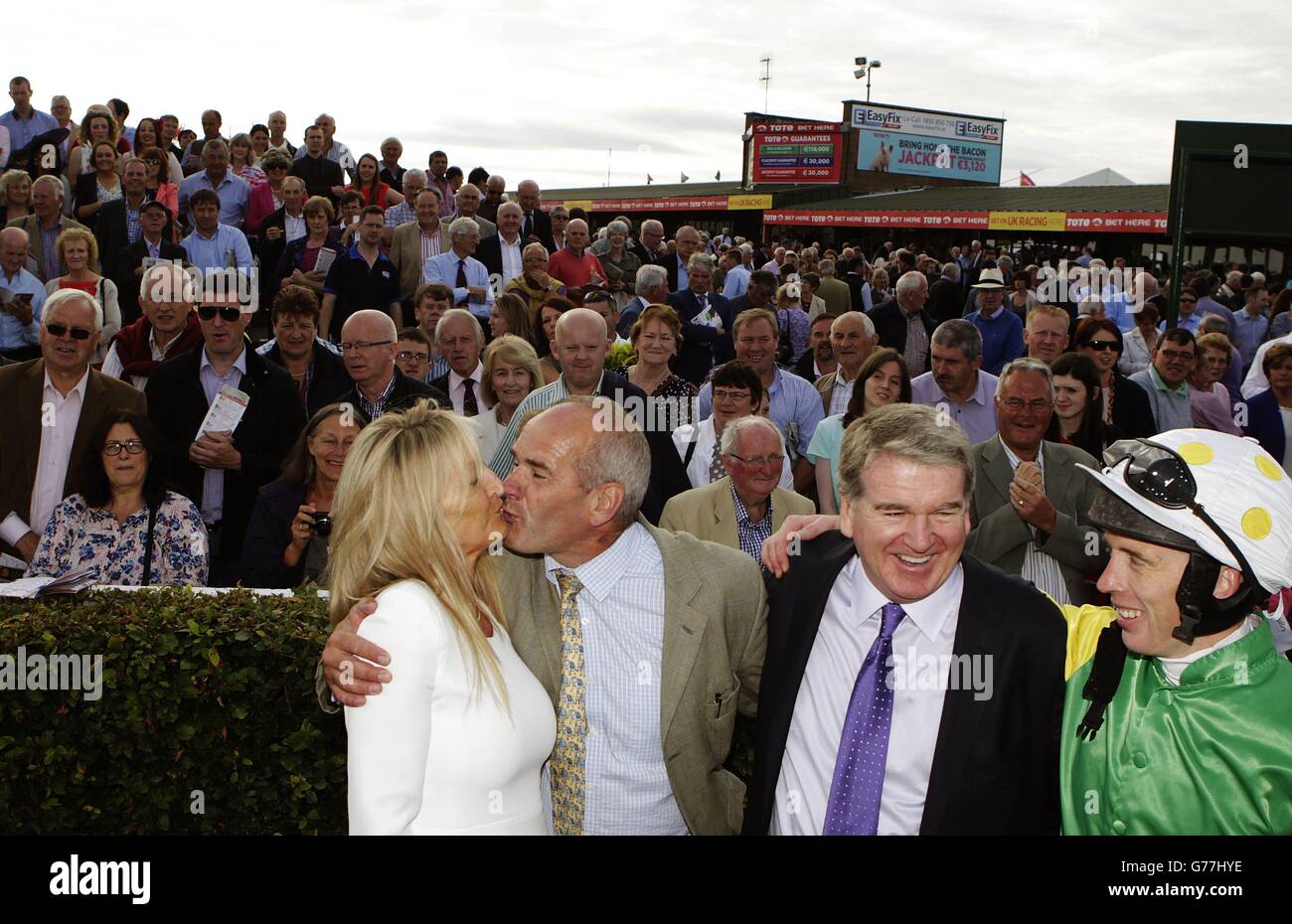 Winning trainer Tony Martin (second left) celebrates with owner John ...