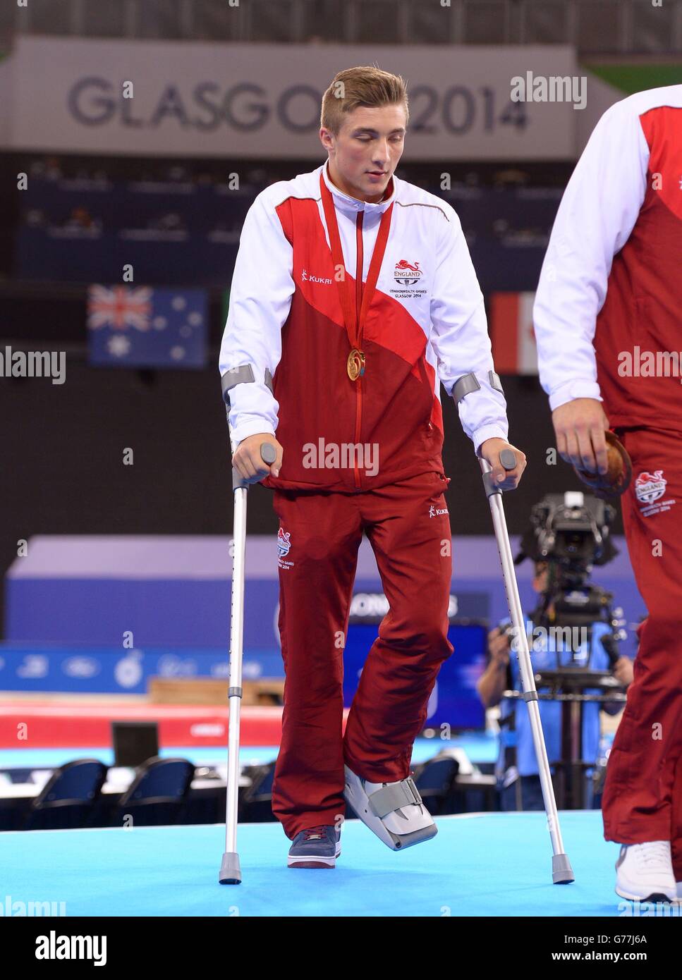 Gold medal winner England's Sam Oldham walks on crutches during the ...