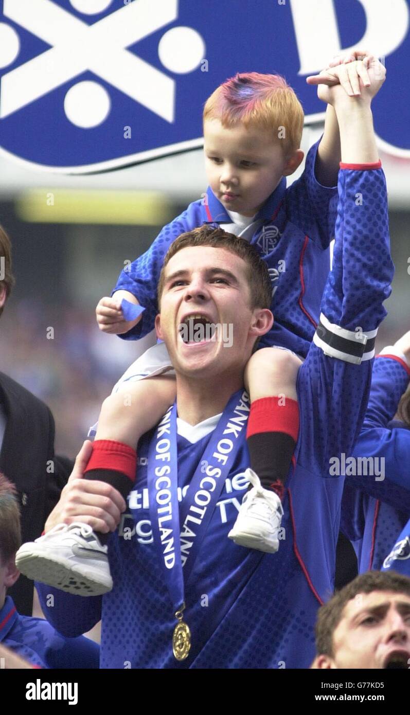 Ranger's captain Barry Ferguson celebrates with his son Kyle after his ...