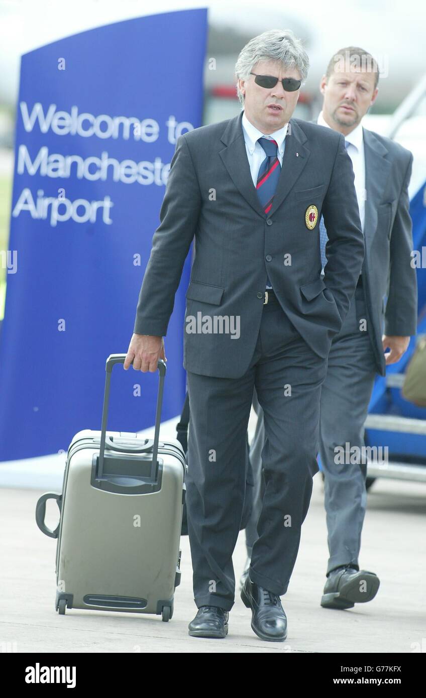 AC Milan coach Carlo Ancellotti arrives at Manchester airport ahead of ...