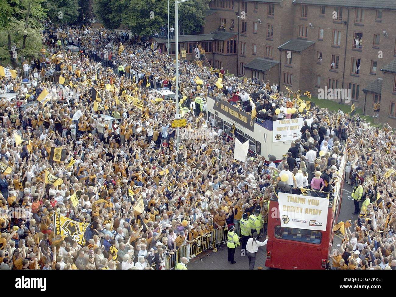 Sport football celebrating lifting trophy smiling crowd fans bus hi-res ...
