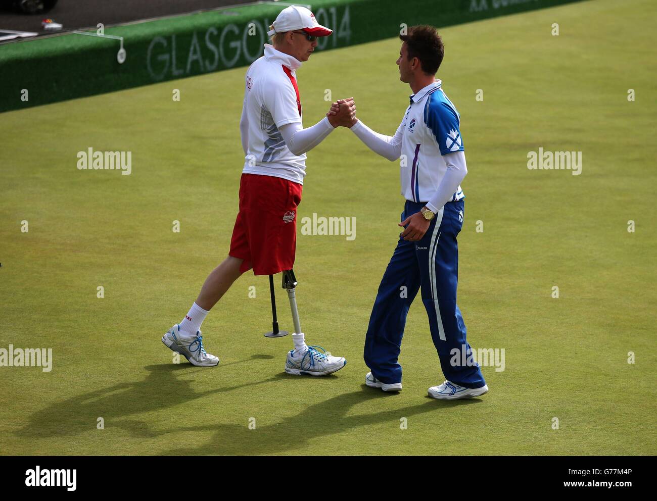 England's skip Paul Brown shakes hands with Scotland's skip Kevin ...