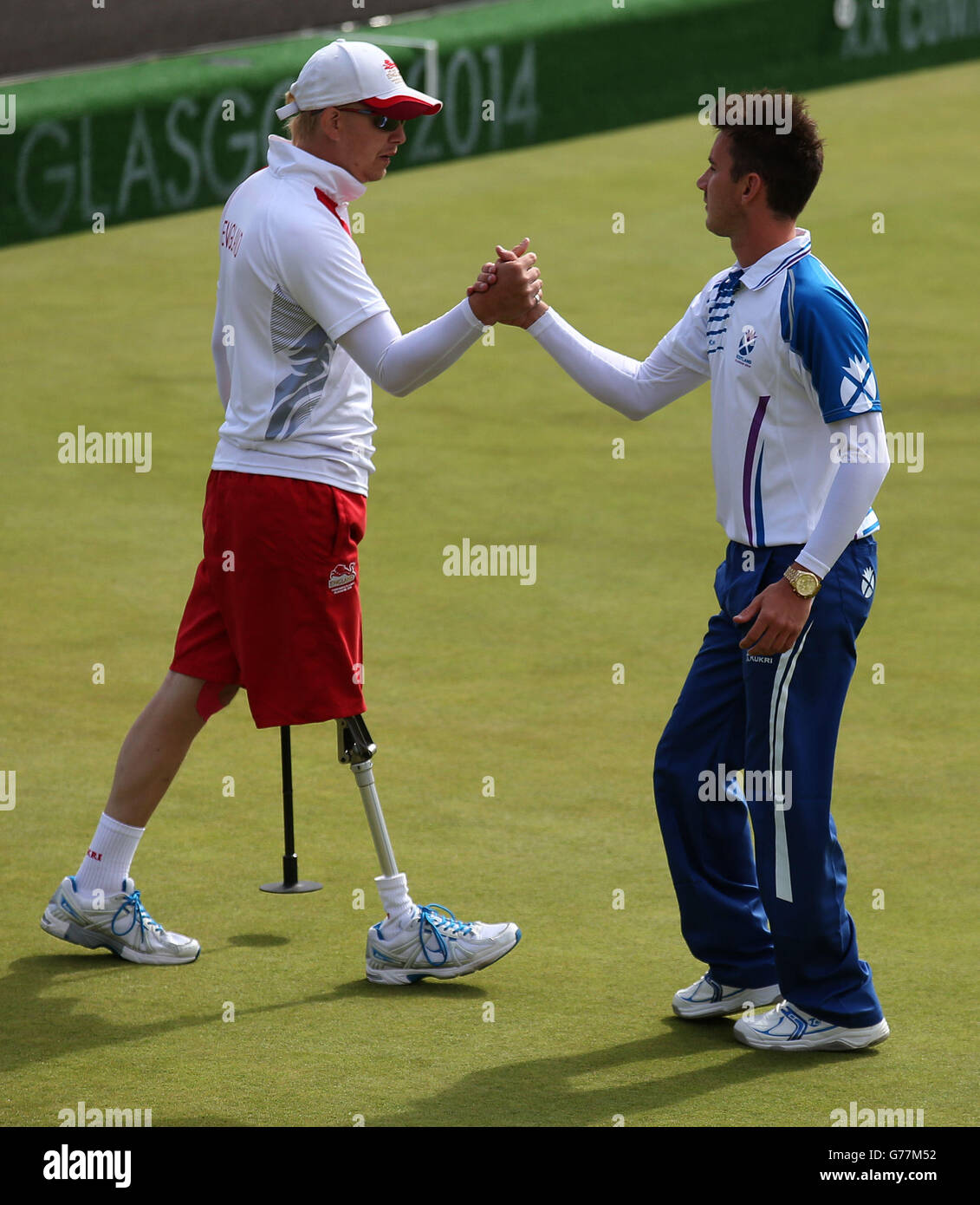 England's skip Paul Brown shakes hands with Scotland's skip Kevin ...