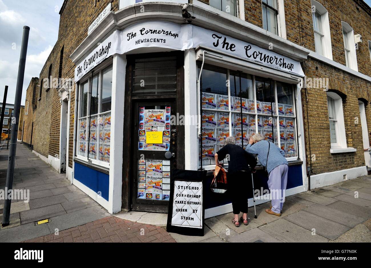 Two local residents try to peek inside The Cornershop in Wellington Row ...