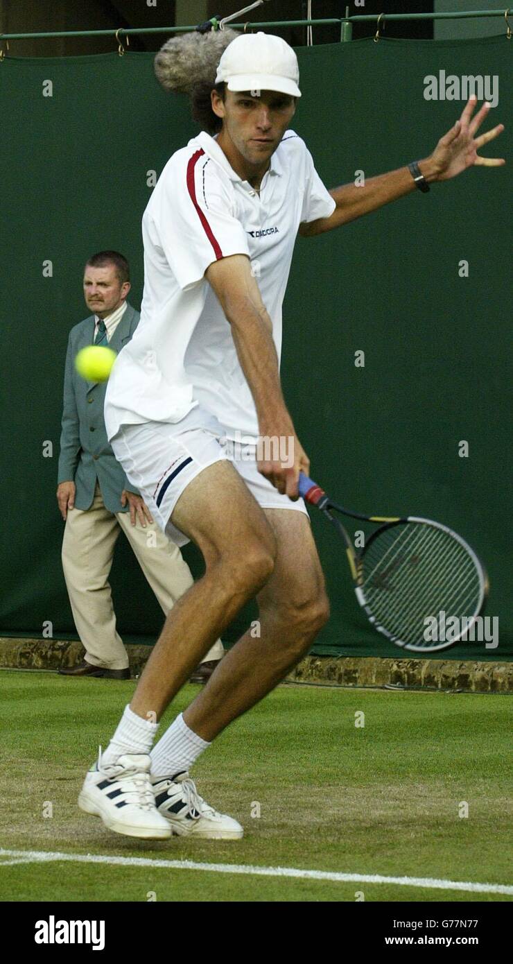Croatian giant, 6ft 4in Ivo Karlovic dwarfs a line judge during his ...