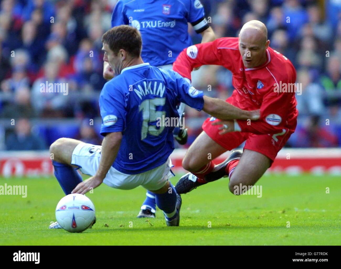 Ipswichs chris makin left under pressure from gillinghams paul shaw hi ...