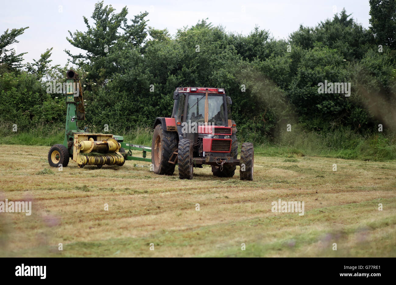 Case farm tractor and a John Deere machine near Sandford in Somerset ...