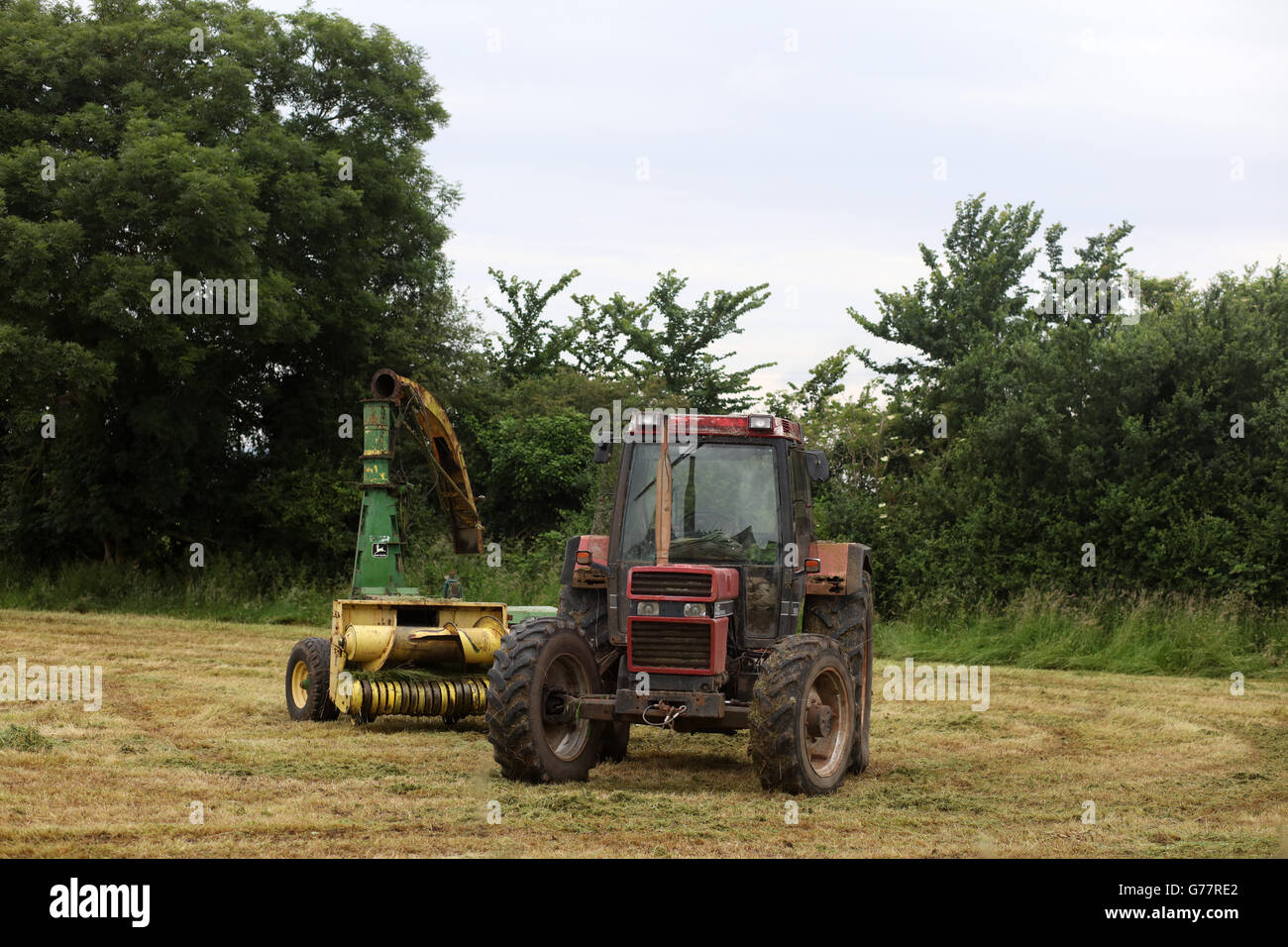 Case farm tractor and a John Deere machine near Sandford in Somerset ...
