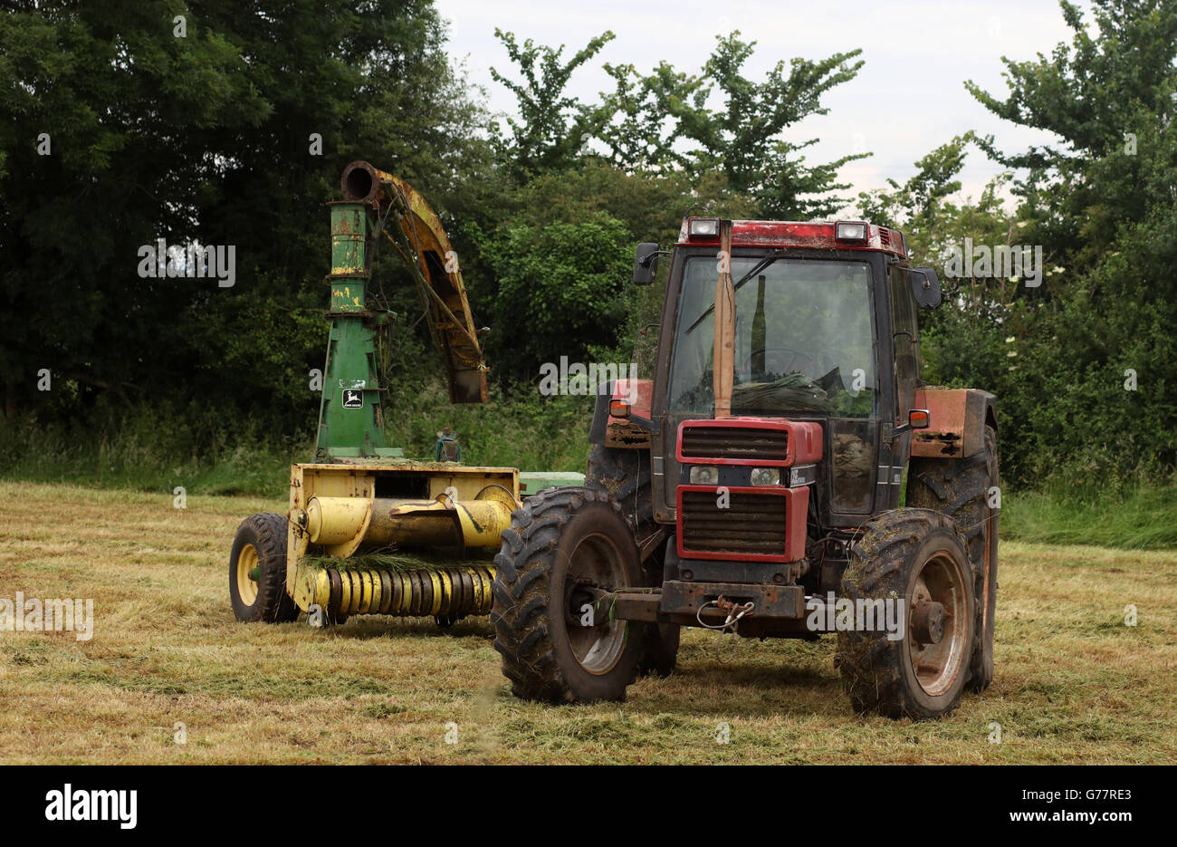 Case farm tractor and a John Deere machine near Sandford in Somerset ...