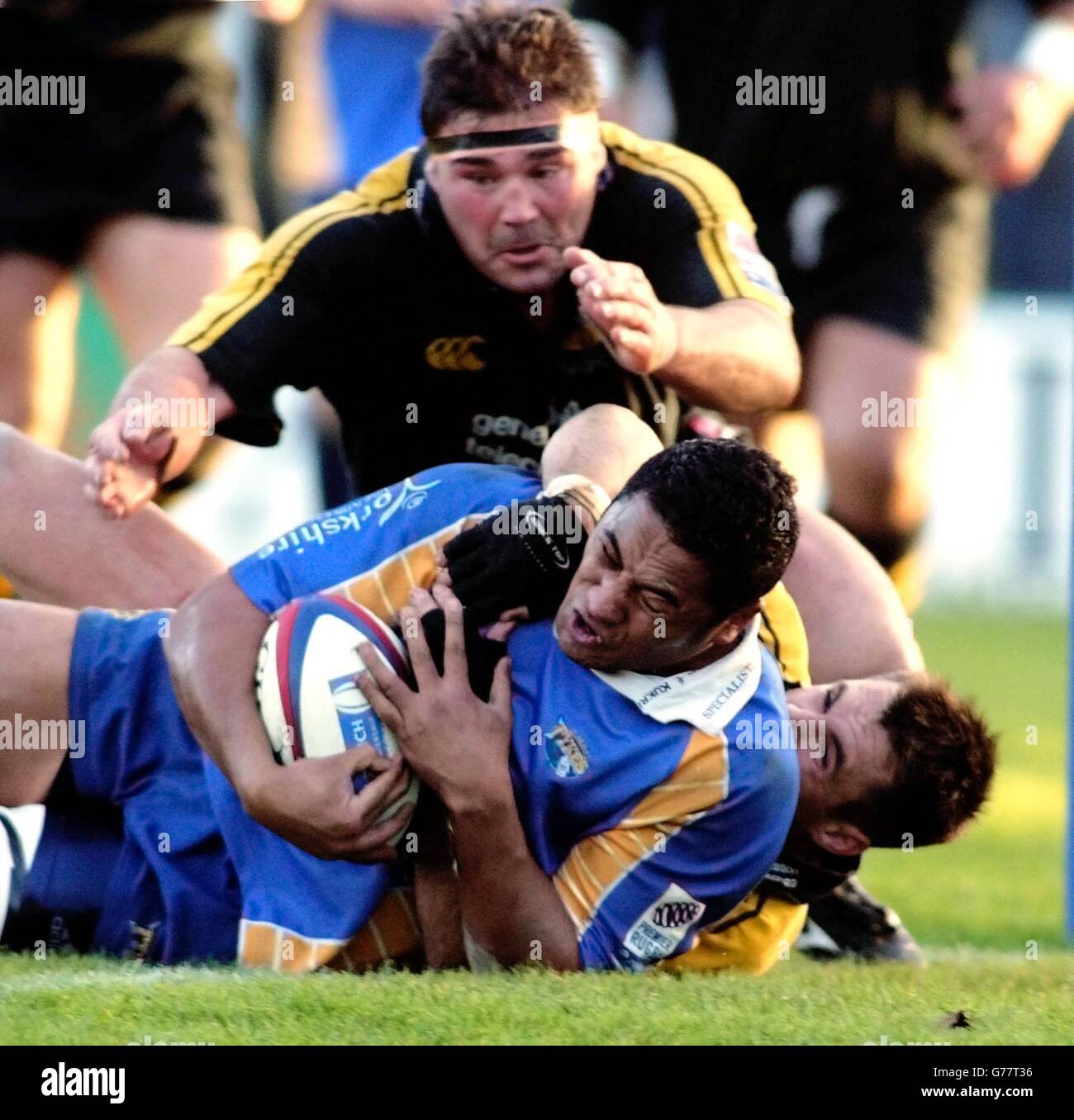 LeedsTykes's Isaac Feaunati (front) is held short of the line during ...