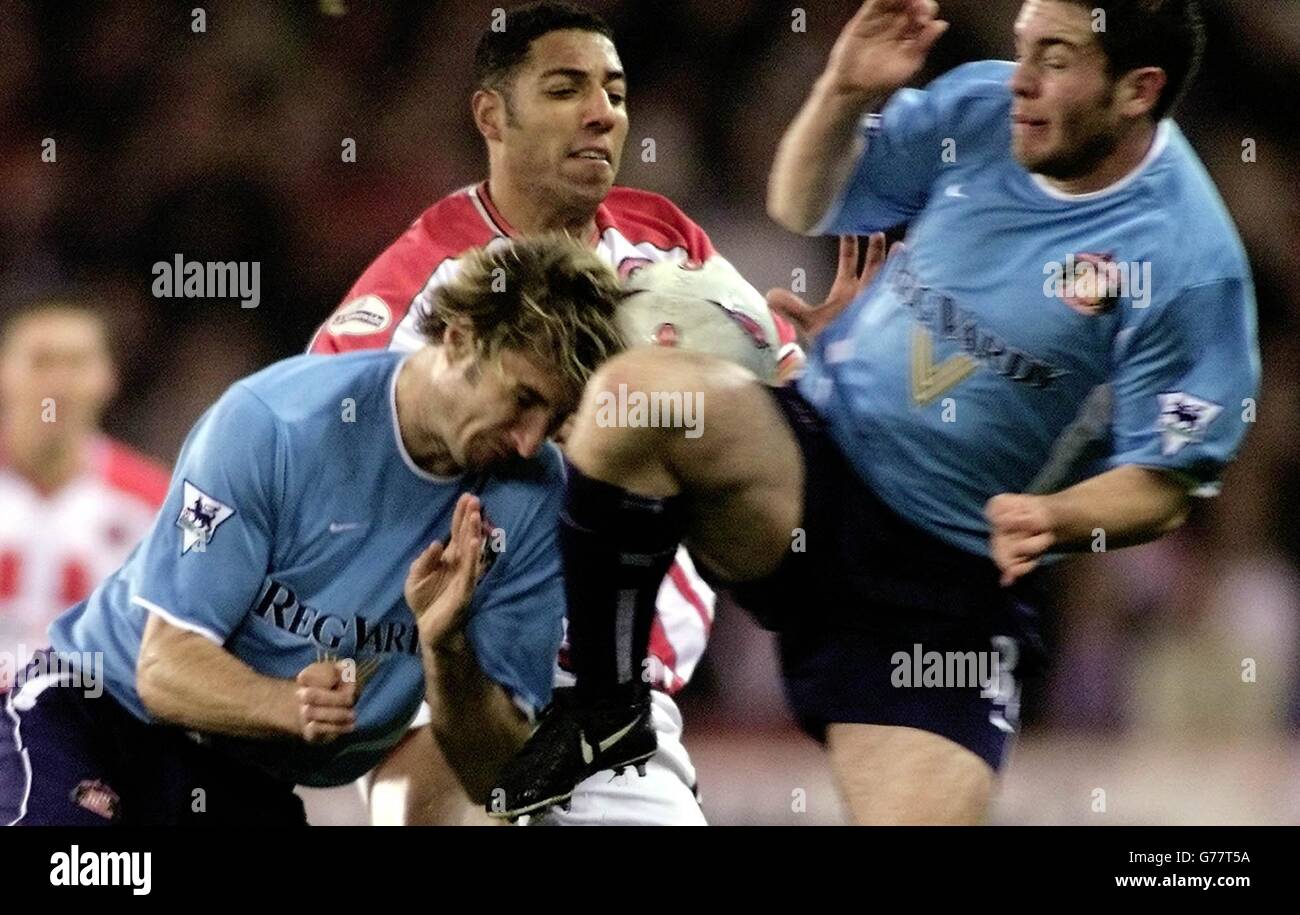 Sheffield United's Carl Asaba is blocked by Sunderland's Stanisslav ...