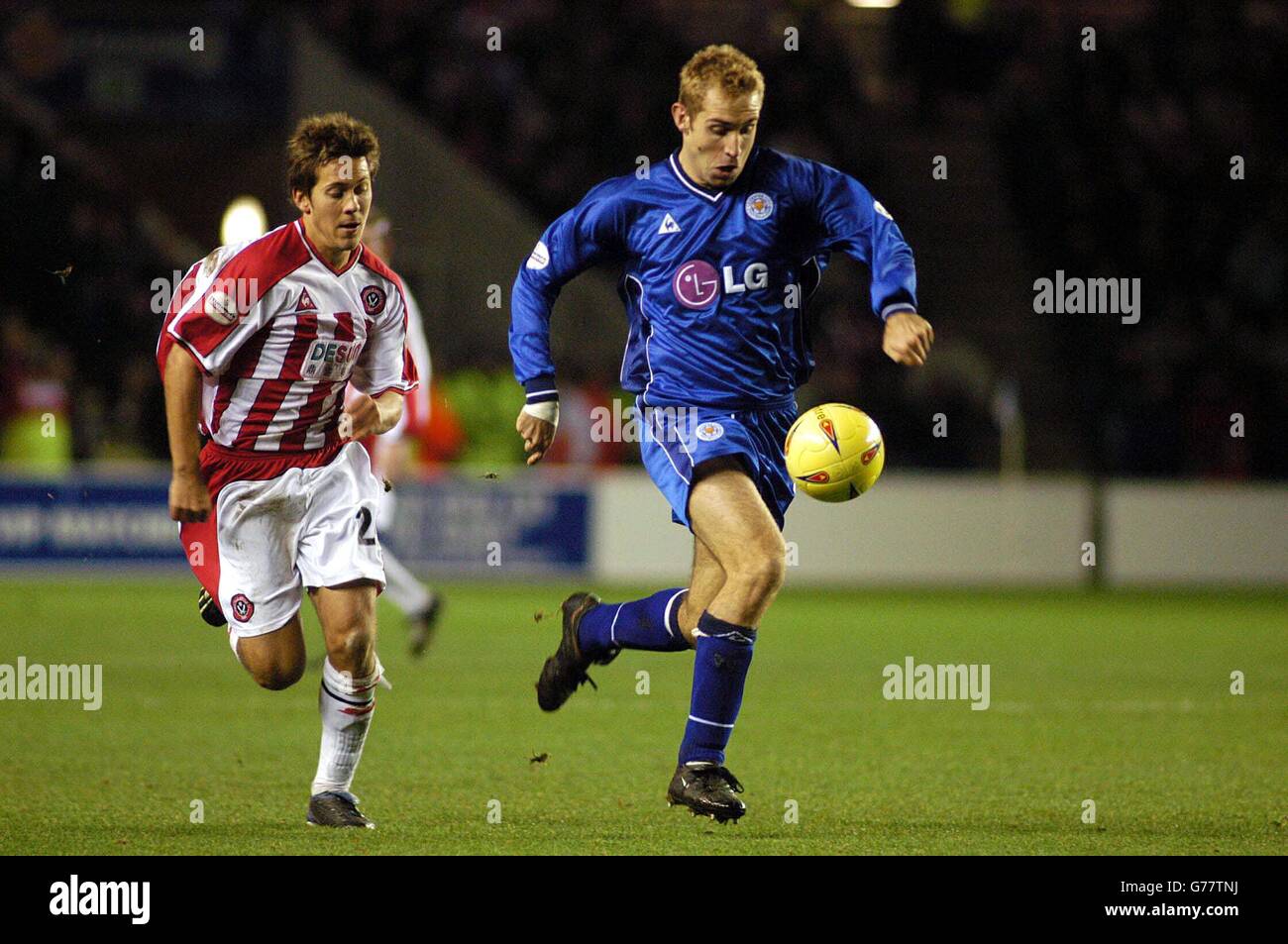 Leicester City striker James Scowcroft (right) being persued by ...