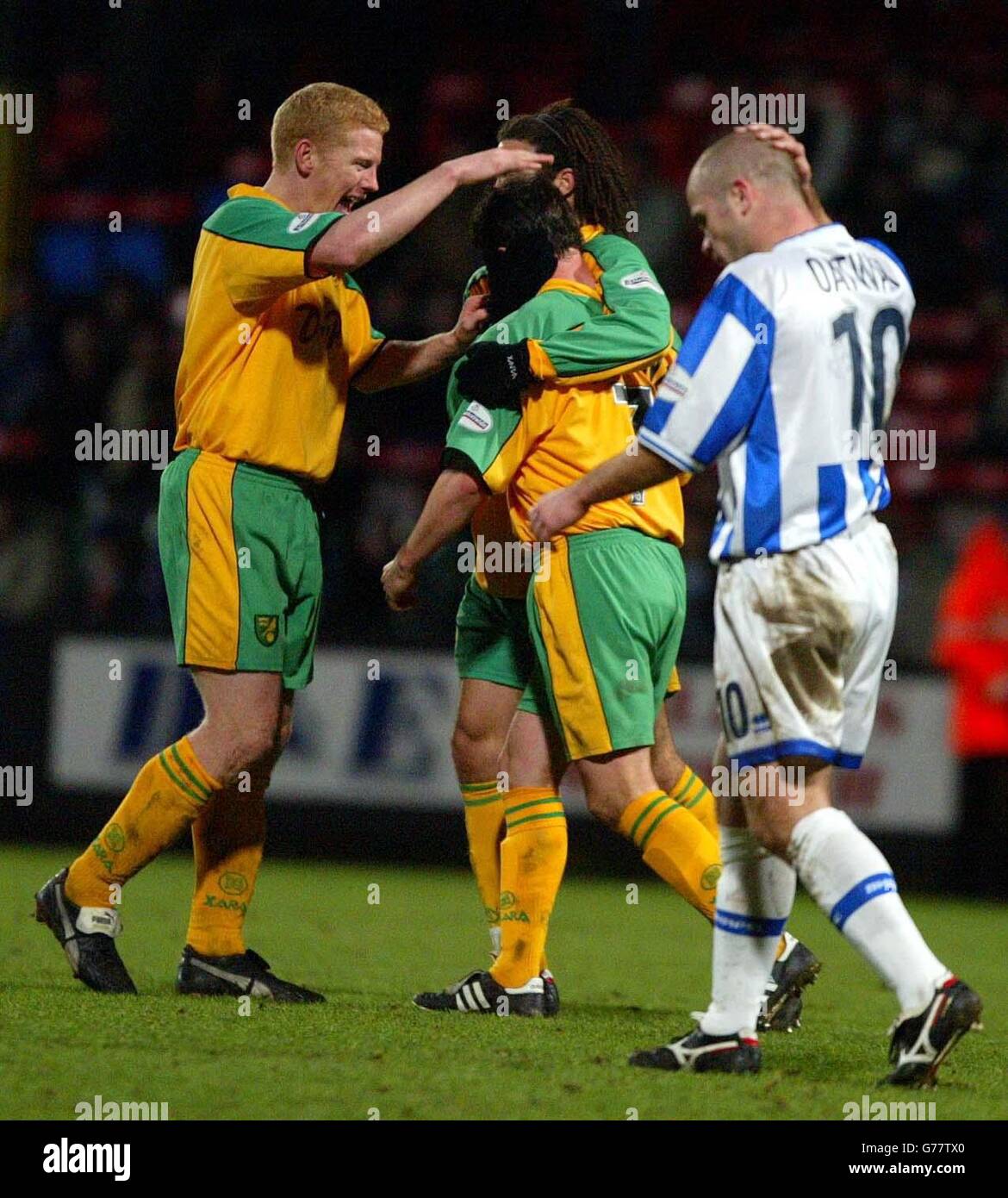 Norwich's Gary Holt (left) celebrates with goalscorer Phil Mulryne ...