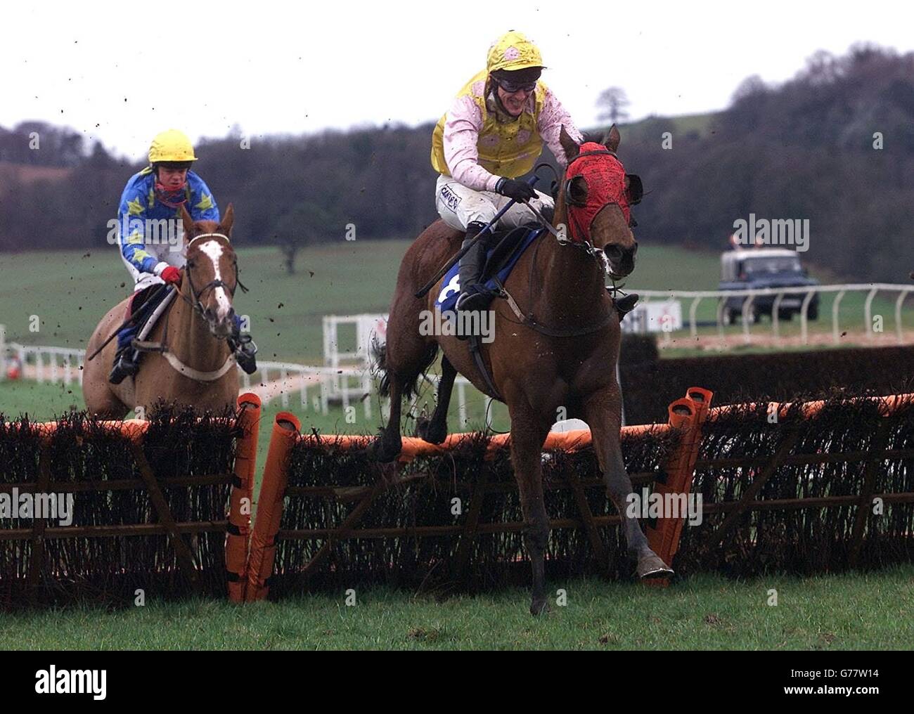Master McGrath ridden by Tony McCoy (right) jumps the last to go on and ...