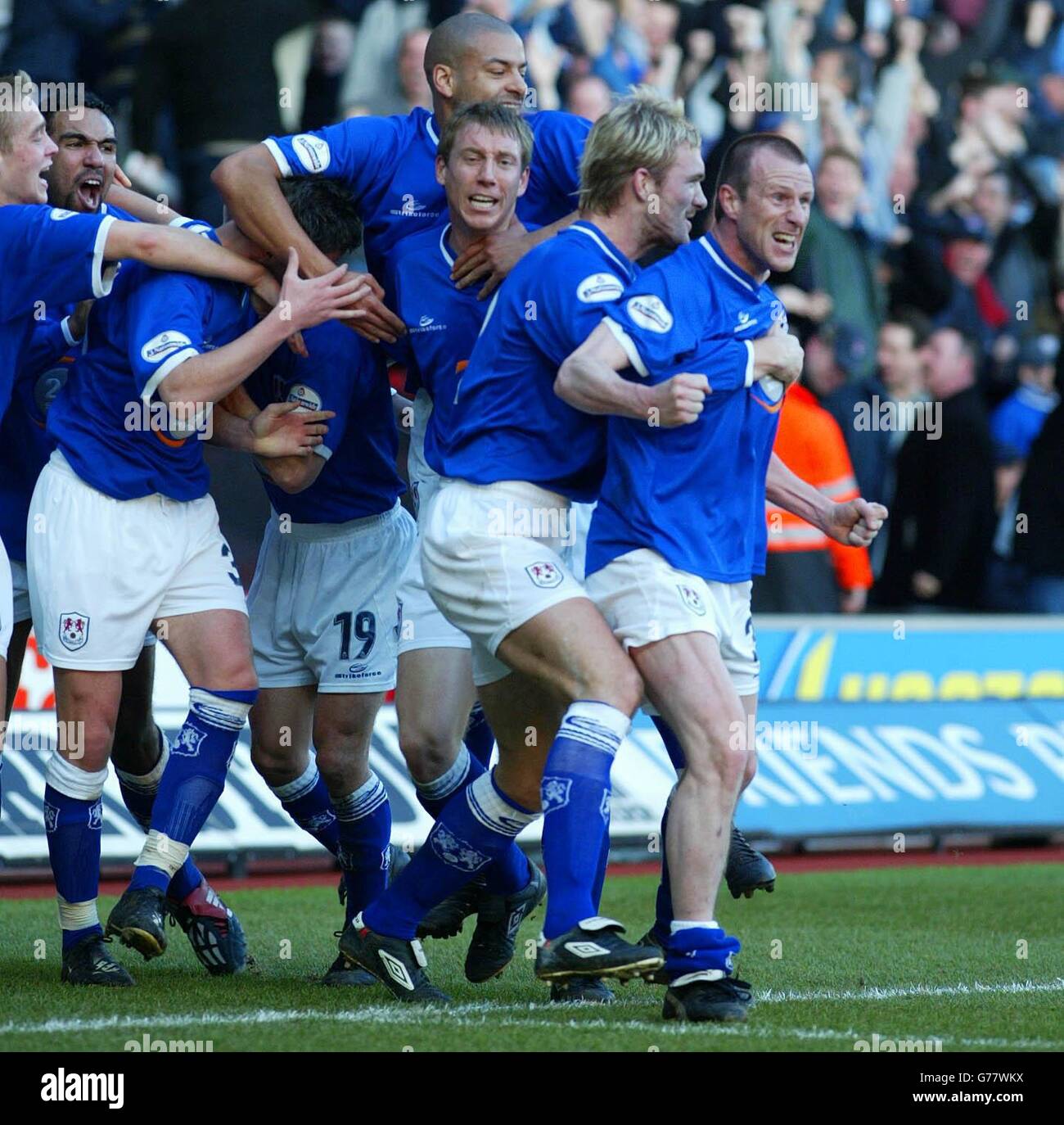 Millwall's goal scorer Steve Claridge (right) leads the celebrations ...
