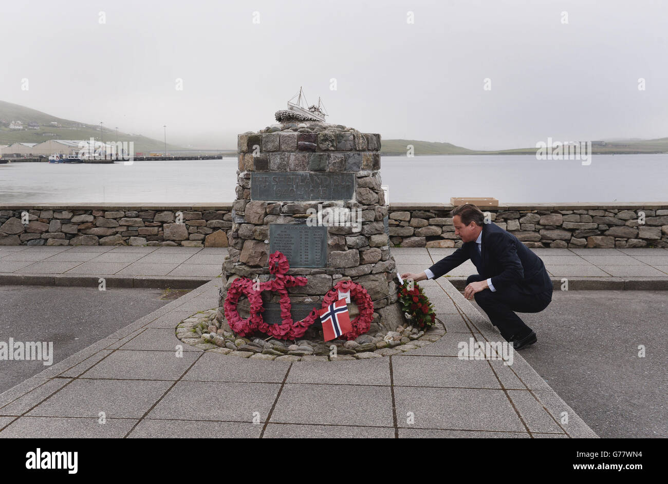 Prime Minister David Cameron lays a wreath at the Shetland Bus memorial ...