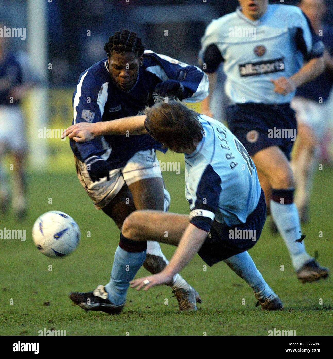 Falkirk's Colin Samuel and Hearts's Steven Presley battle for the ball ...
