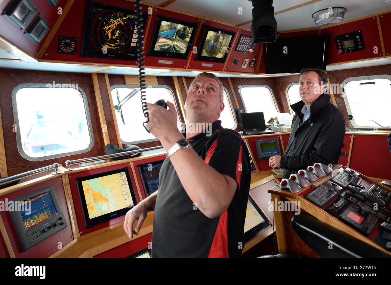 Prime Minister David Cameron as he taken out to sea on the fishing boat ...