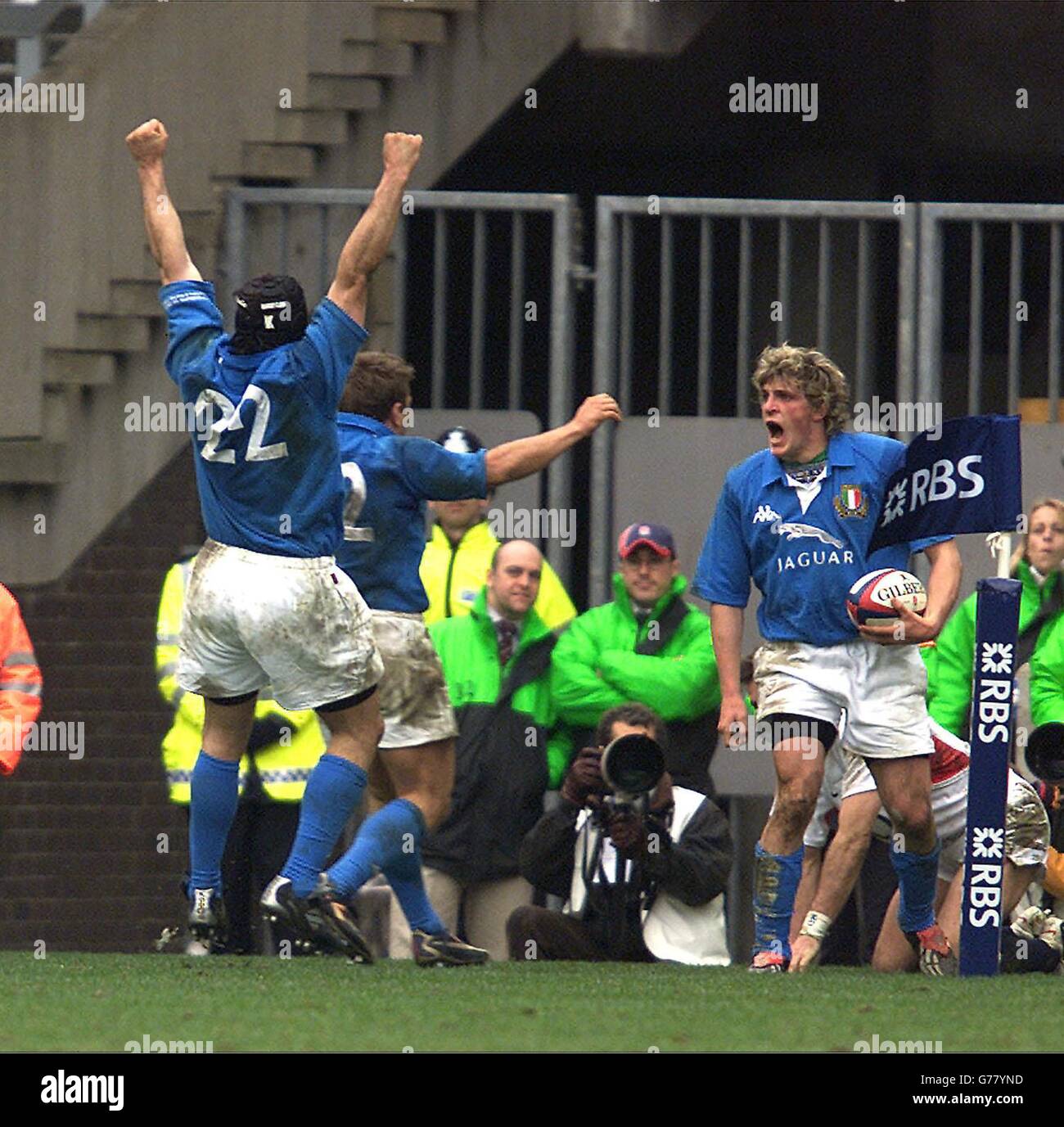 Italy's Mirco Bergamasco (facing) scores the only Italian try against ...