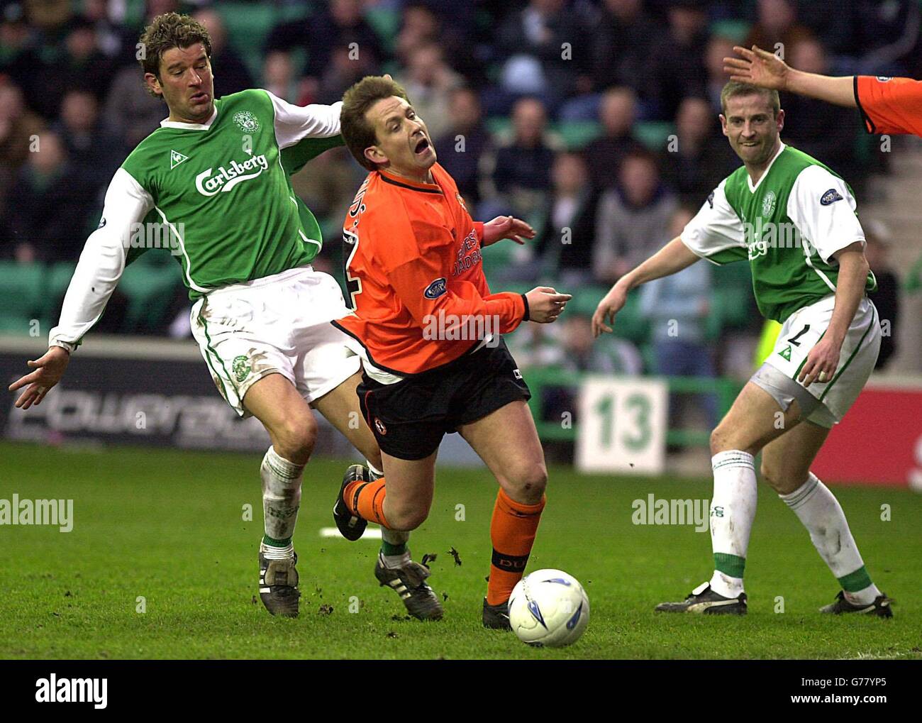 Hibernian's Mathias Jack tackles Dundee United's Billy Dodds in the ...