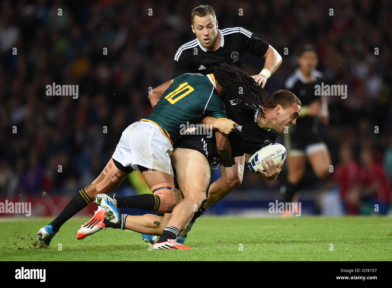 South Africa's Cecil Afrika (left) tackles New Zealand's Joe Webber ...