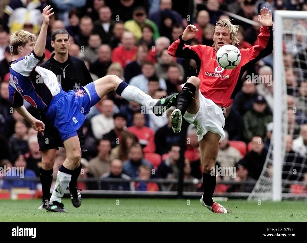 Manchester United's David Beckham (right) is tackled by Blackburn ...