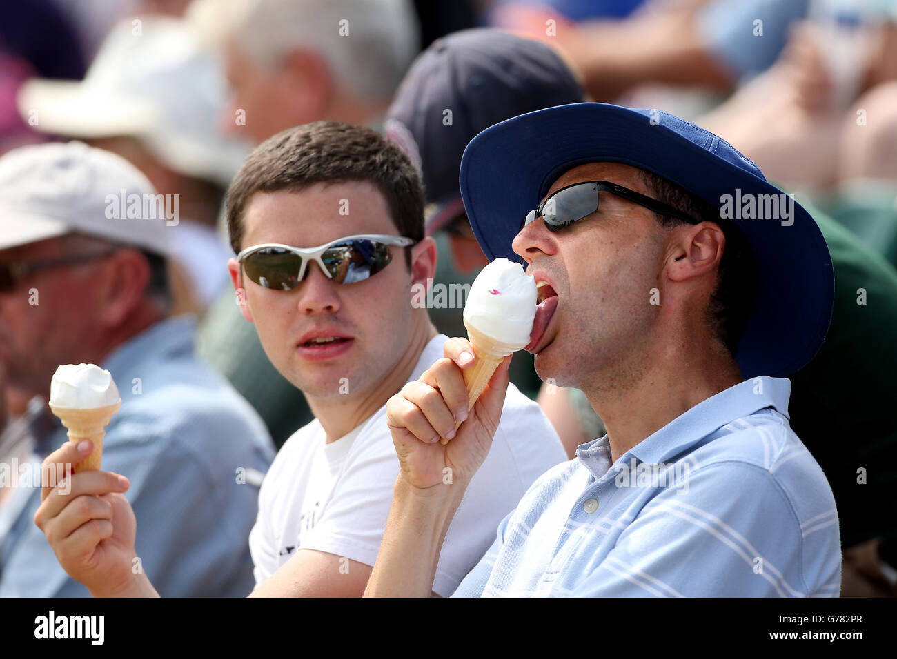 Surrey fans enjoy an ice cream at guildford cricket club hi-res stock ...