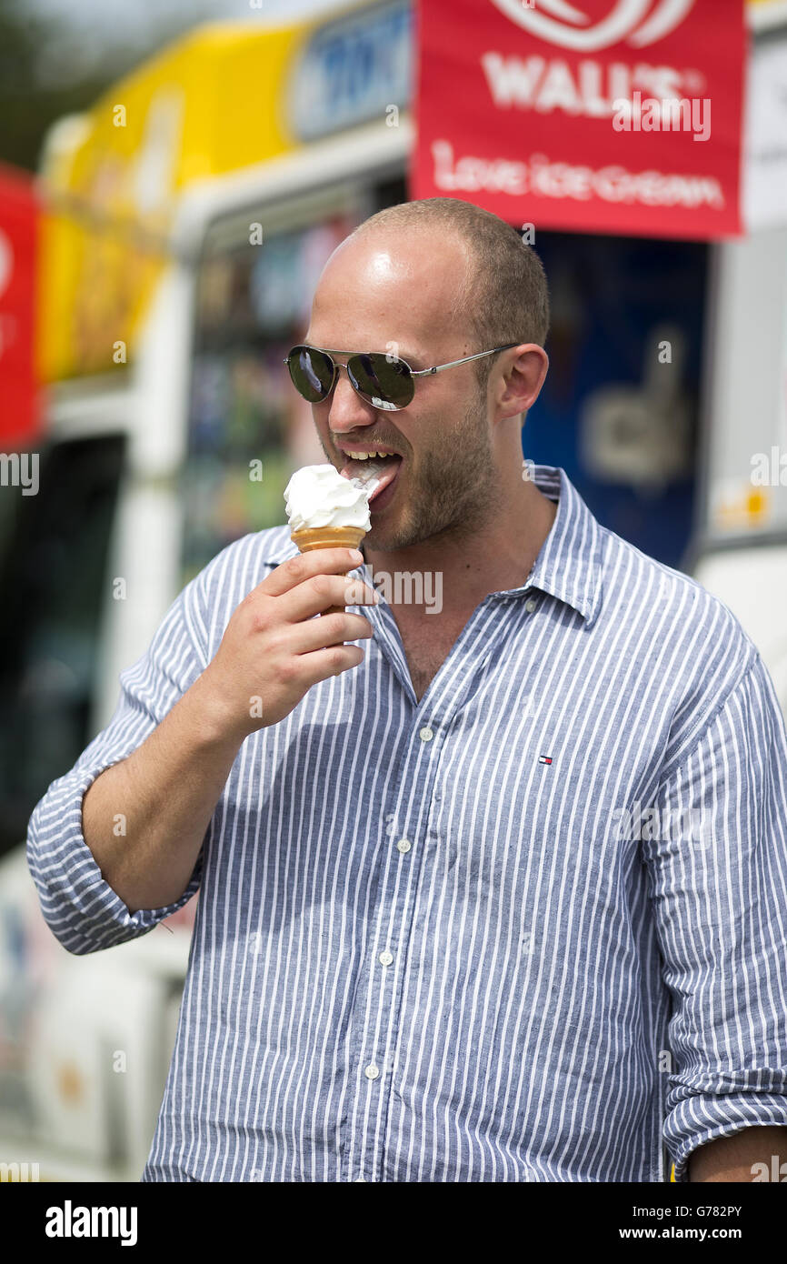 A Surrey fan with an ice cream at Guildford Cricket Club Stock Photo ...