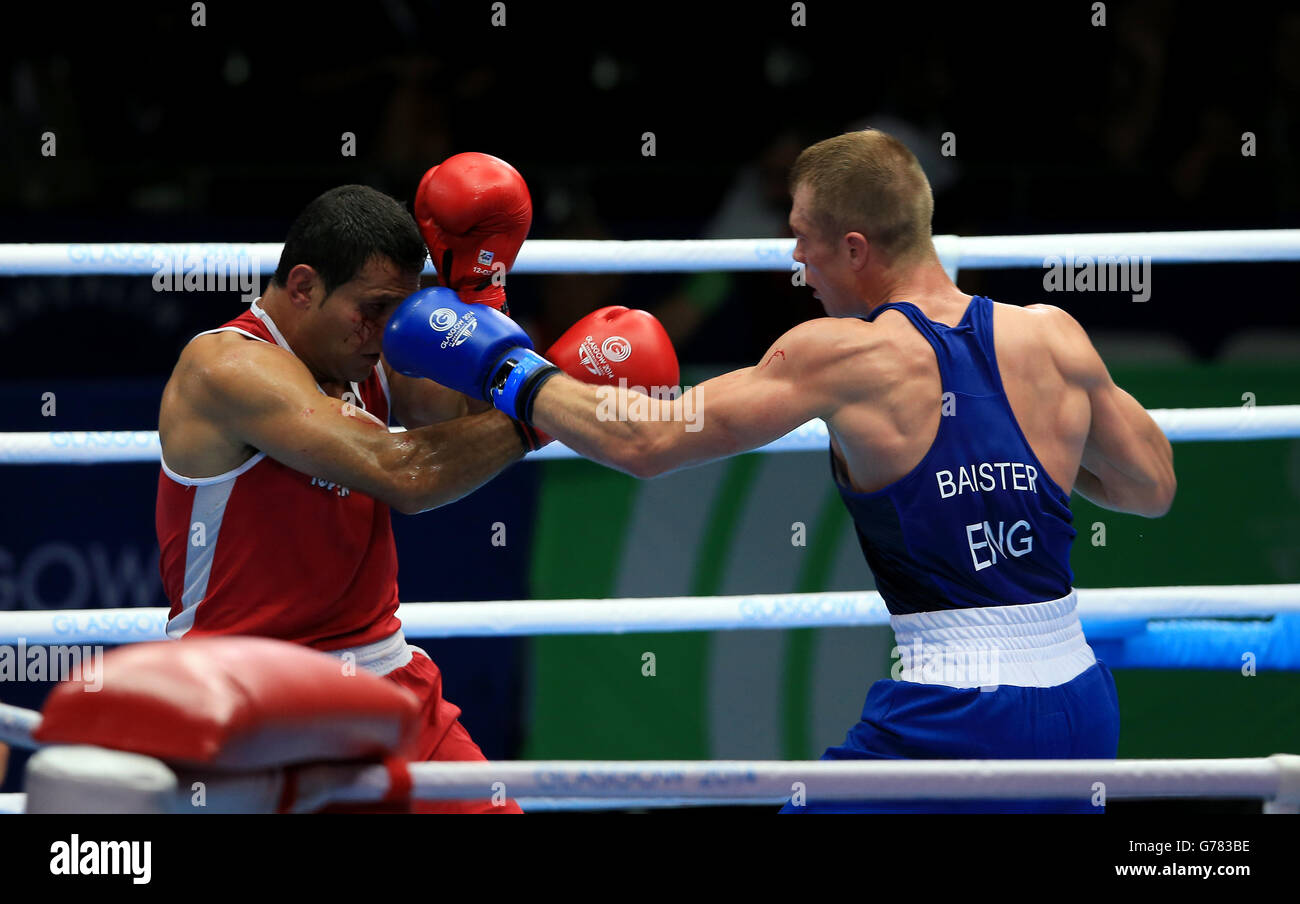 England's Warren Baister (blue) in action against Canada's Samir El ...