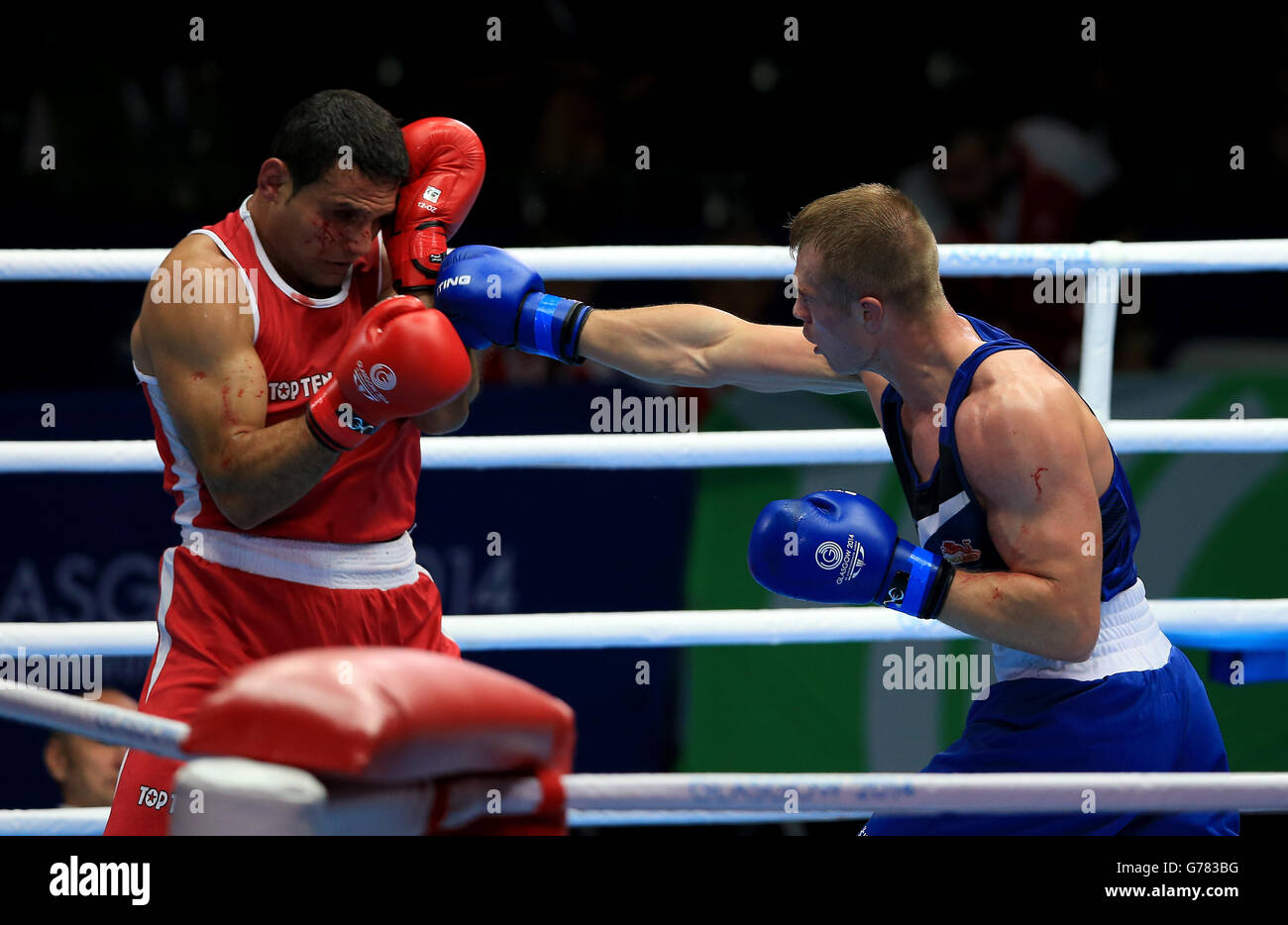 England's Warren Baister (blue) in action against Canada's Samir El ...