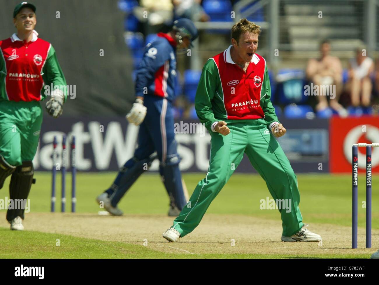 Wales skipper Robert Croft celebrates taking the wicket of England ...