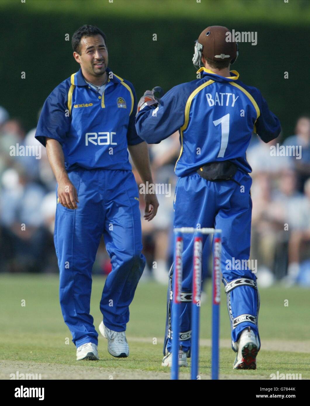 Surrey's Adam Hollioake and Jonathan Batty congratulate each other as ...