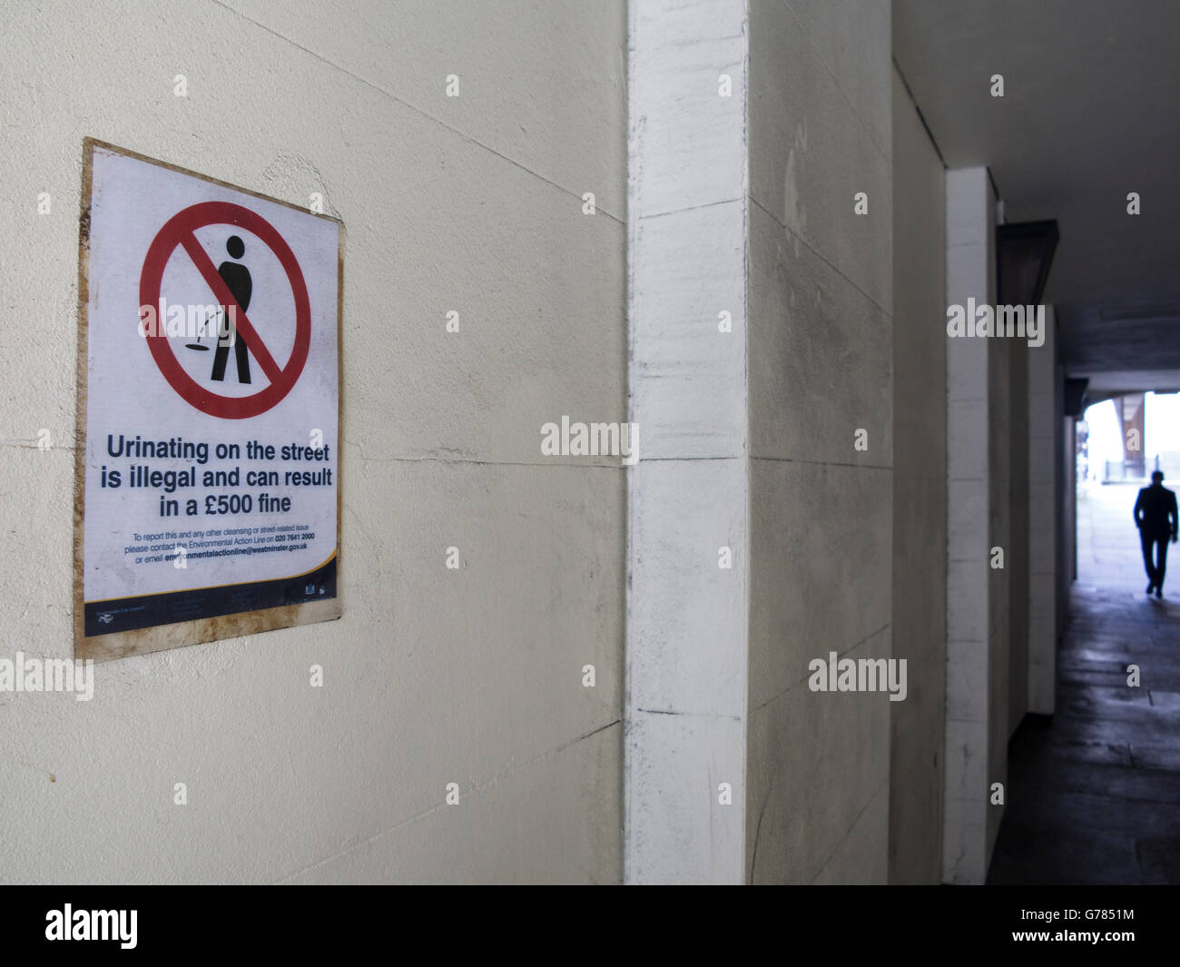 Sign banning urinating in street Stock Photo - Alamy