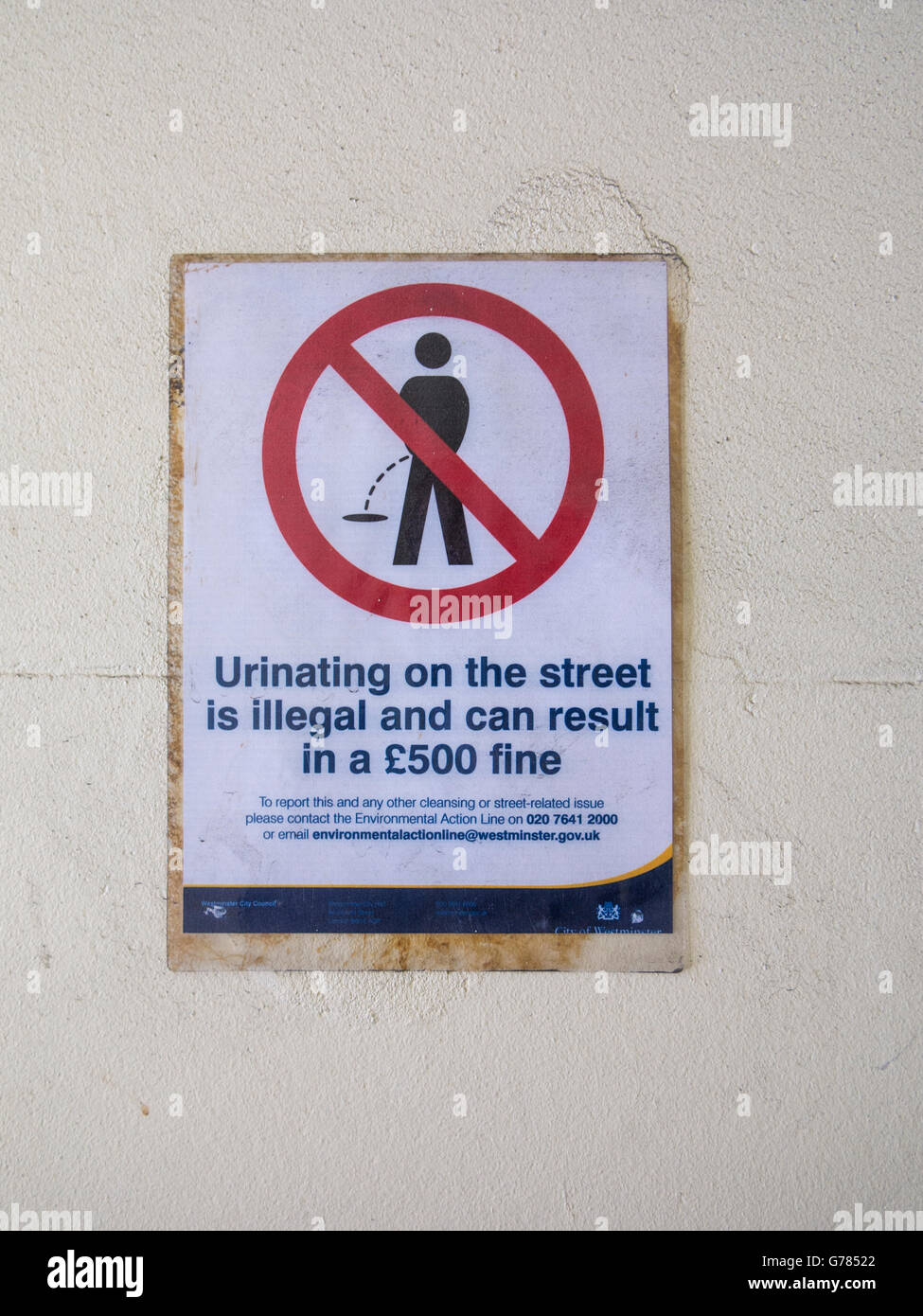 Sign banning urinating in street Stock Photo - Alamy