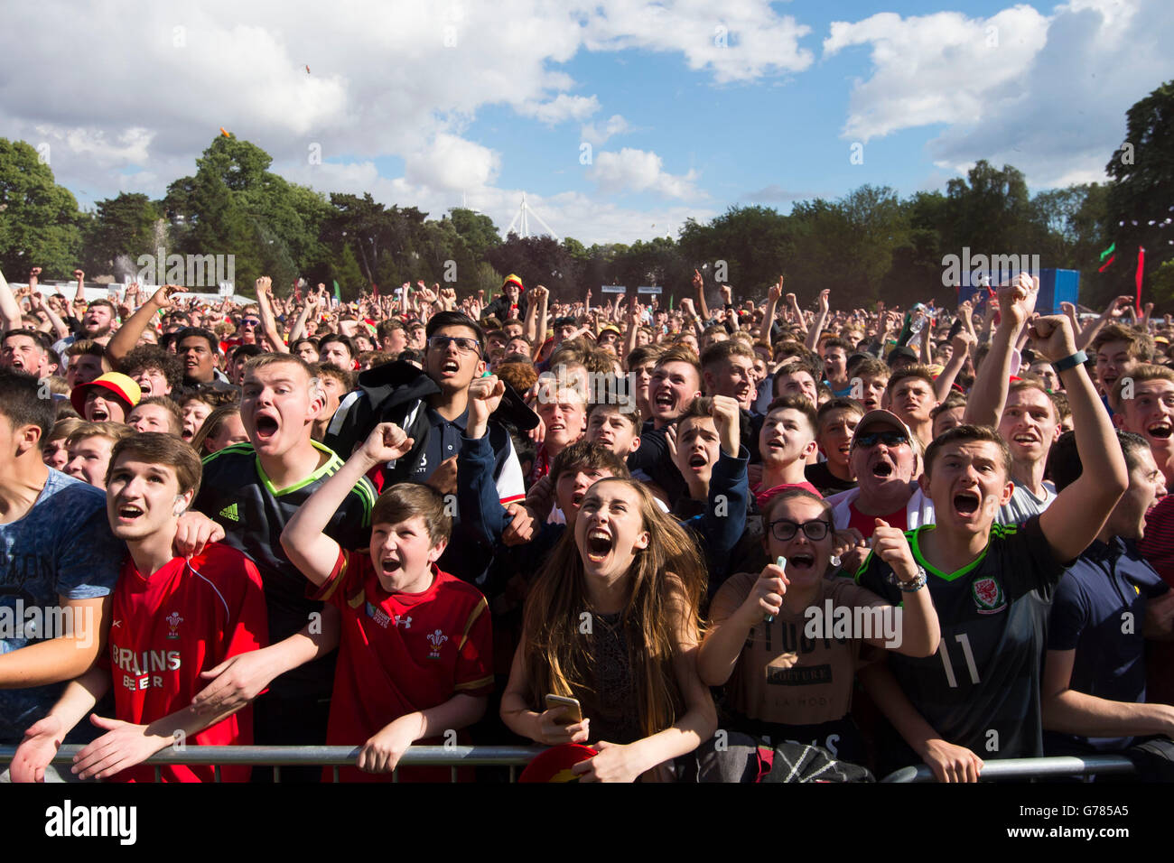 Welsh football fans celebrate in the Cardiff fan zone in Coopers Field ...
