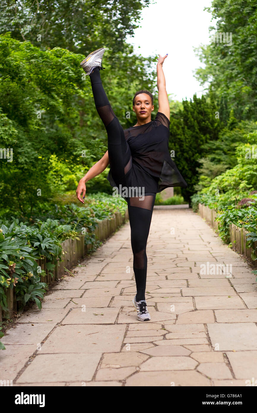 Jazz dancer performing a kick outdoors Stock Photo - Alamy