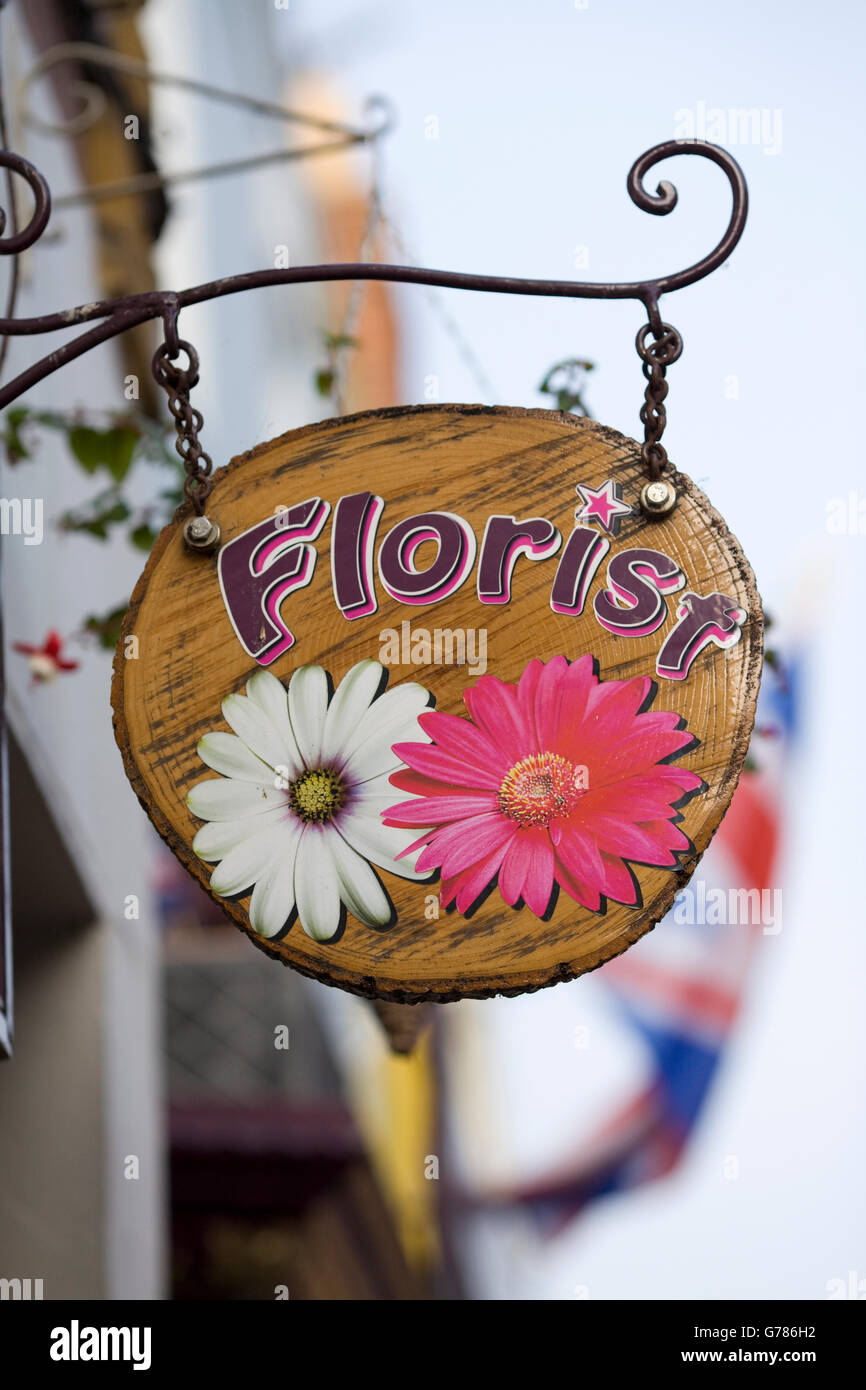 wooden florist sign on a metal hanger Stock Photo - Alamy